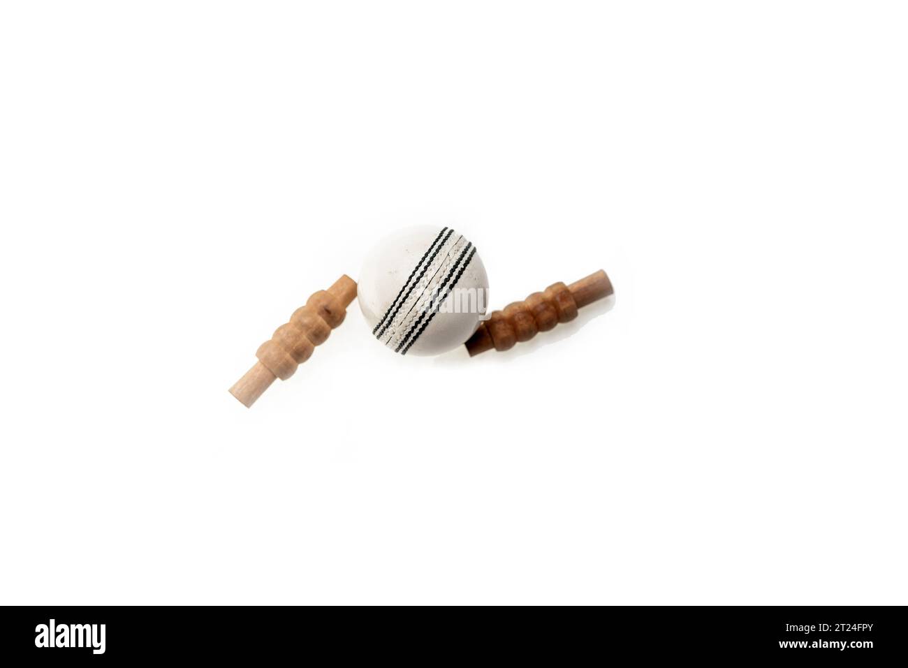 Cricket ball and bails are on isolated white background Stock Photo - Alamy