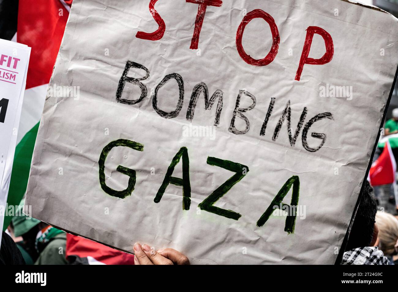 'Stop Bombing Gaza' placard is displayed by a protestor in front of the ...