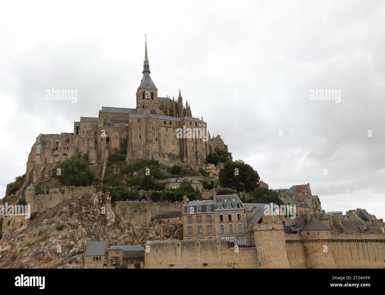 famous monastery of Mont Saint Michel with the Abbey church built above ...
