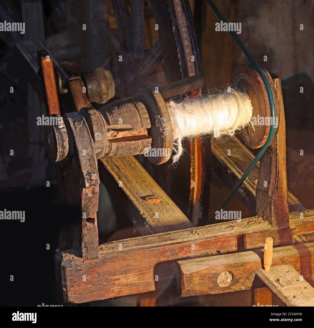 ancient wooden spinning wheel for balls of wool or cotton used by ...