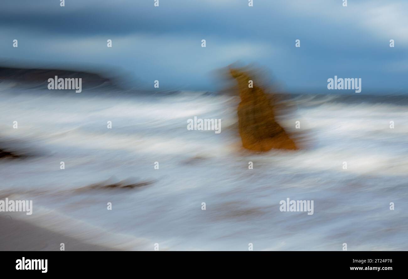 Intentional camera movement (ICM) of a coastal scene with stormy sea ...