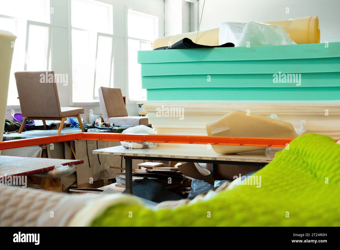 Stacked sheets of foam rubber for furniture production in factory ...
