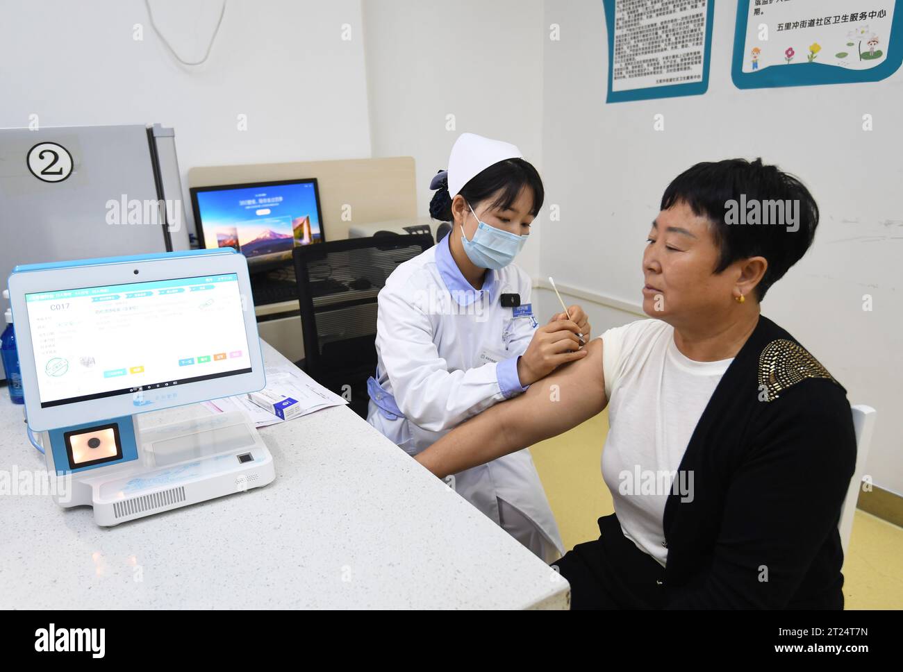 GUIYANG, CHINA - OCTOBER 17, 2023 - A medical worker inoculates people ...