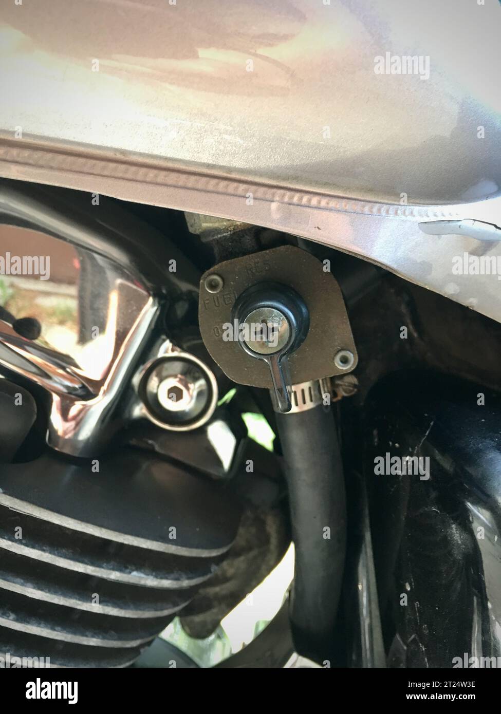 A valve for closing and opening the fuel flow in a motorcycle Stock ...