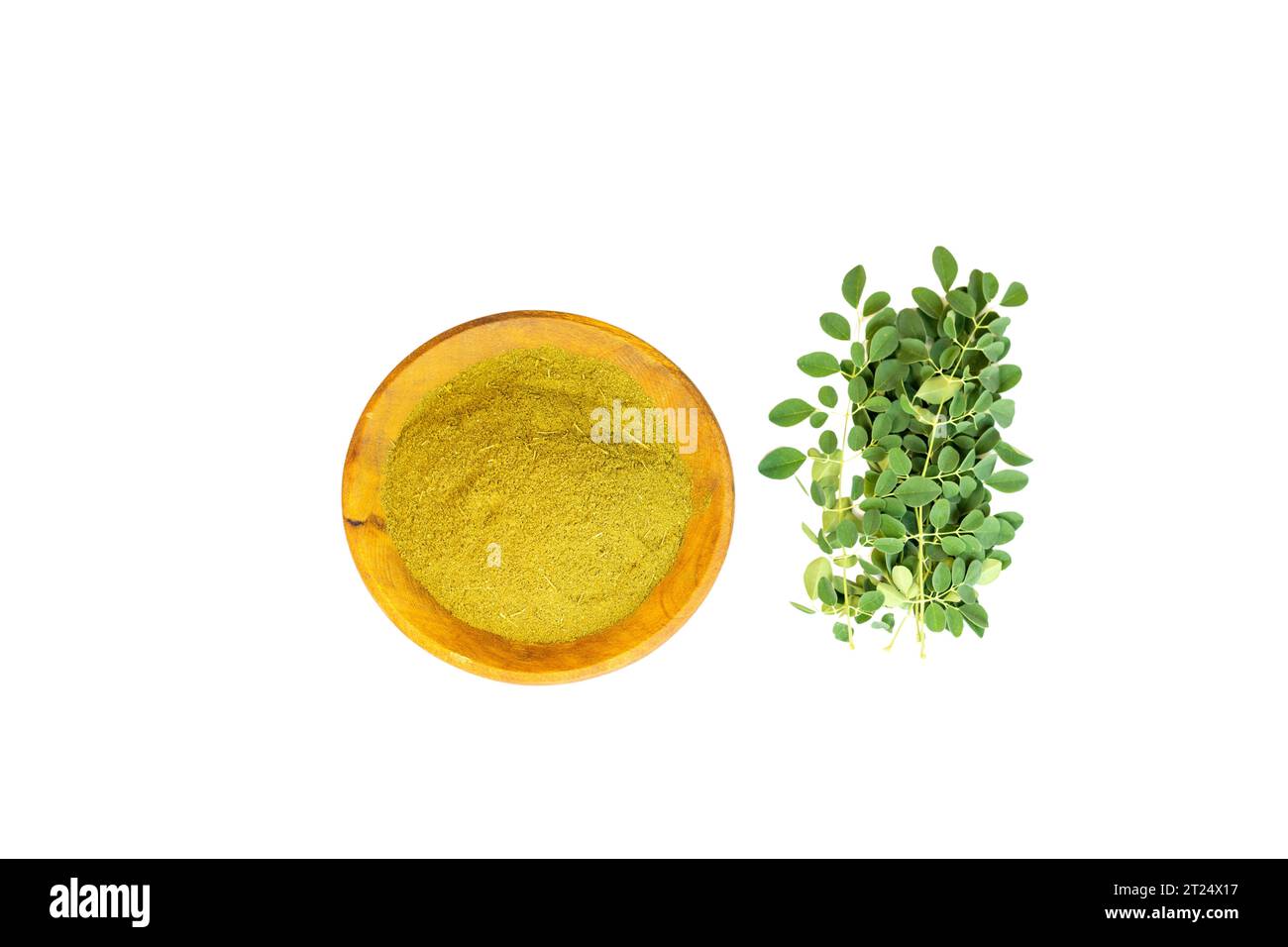 Moringa Oleifera in wooden bowl with fresh moringa leaves isolated on a ...