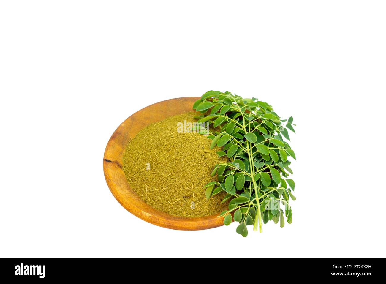 Moringa powder in wooden bowl with moringa leaves isolated on a white ...
