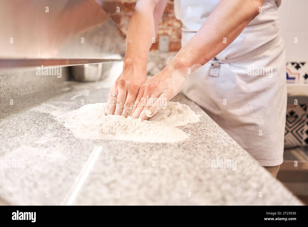 The chef prepare pizza. Raw pizza ready to bake. Cook in a apron in the ...
