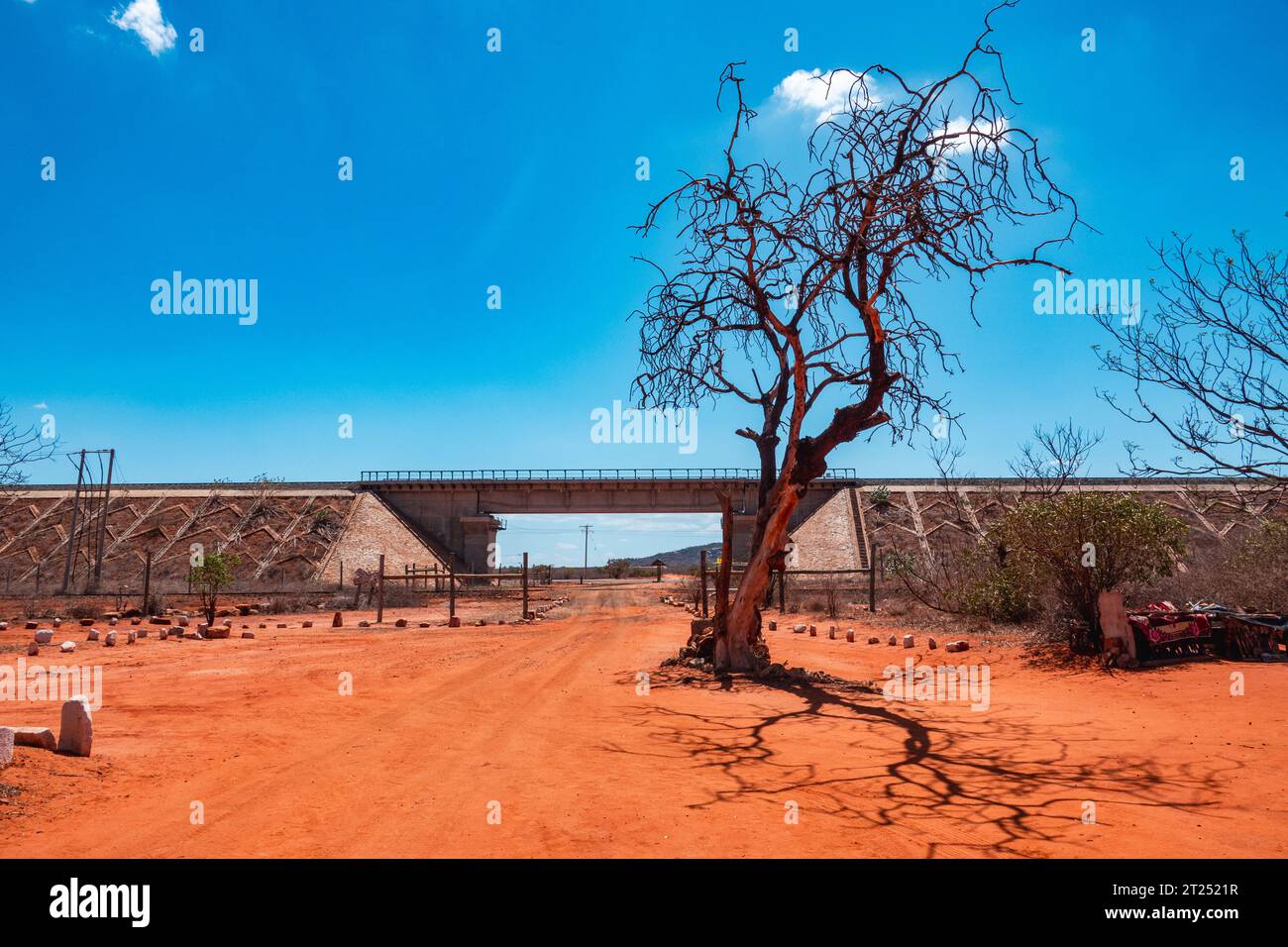 A dirt road below a railway bridge at Tsavo East Nationa Park, Kenya ...