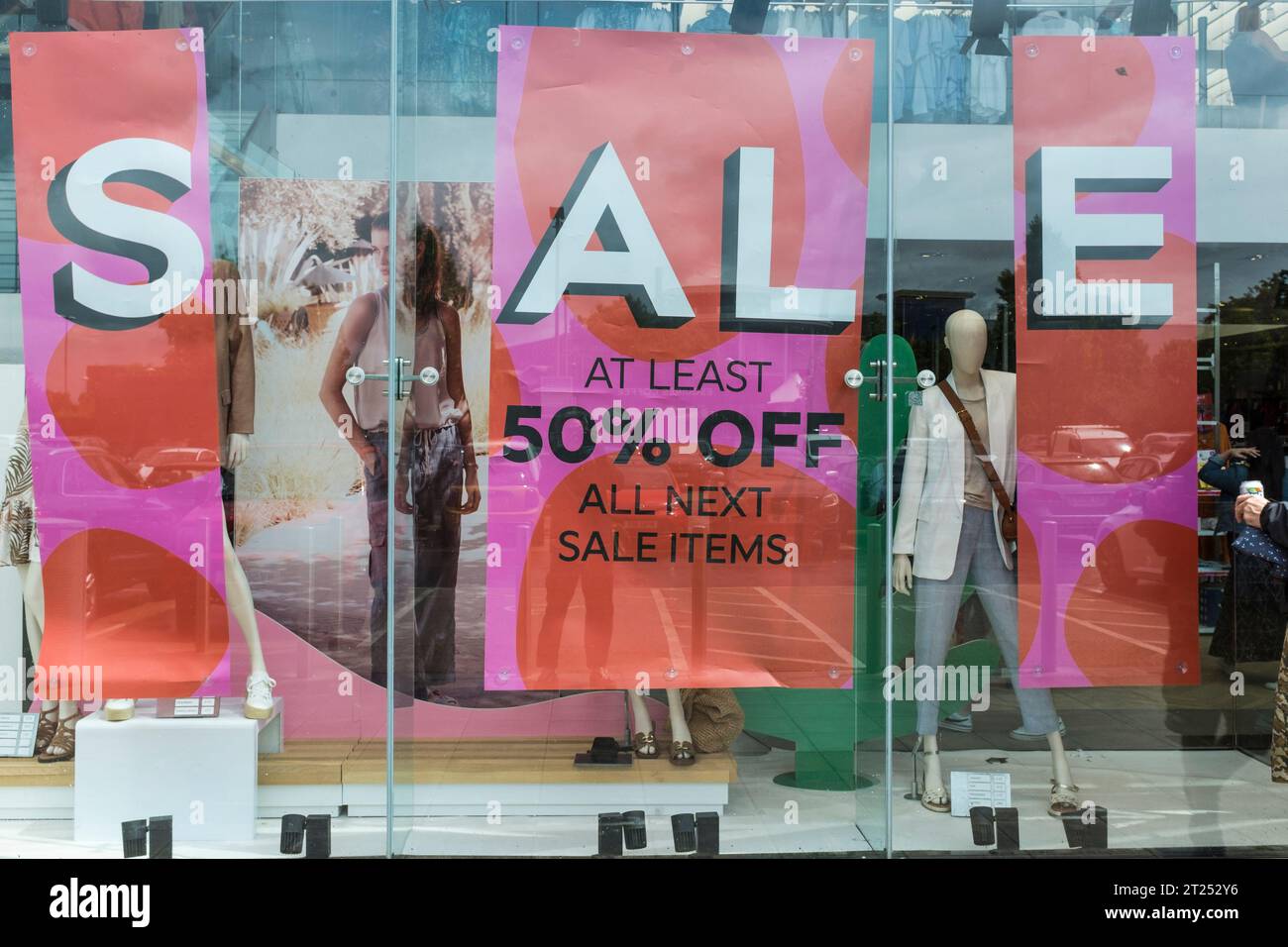 Large sale sign on shop windo of Next, UK Stock Photo - Alamy