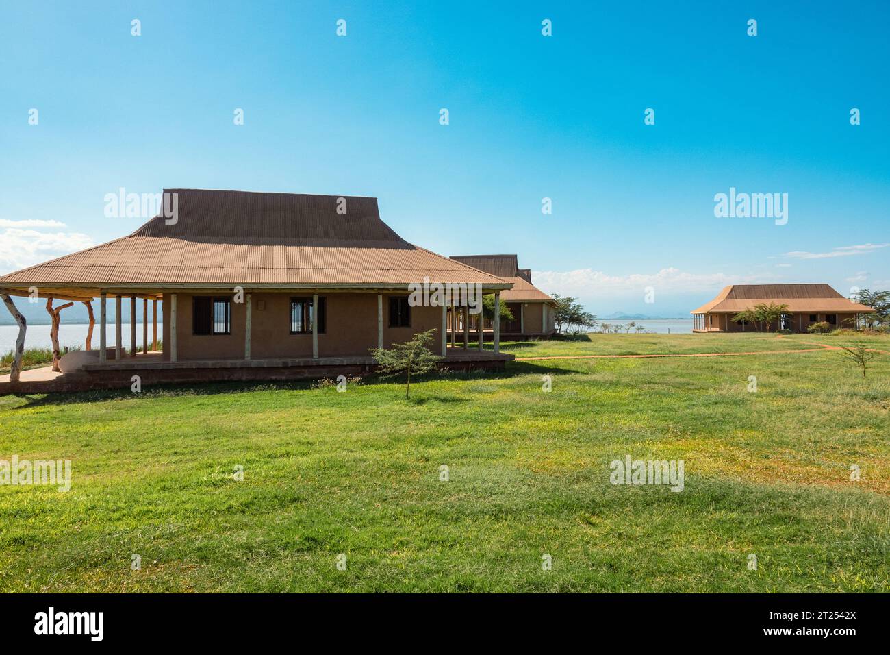 Scenic view of lakeshore cabins at Lake Jipe Campsite at Tsavo West ...