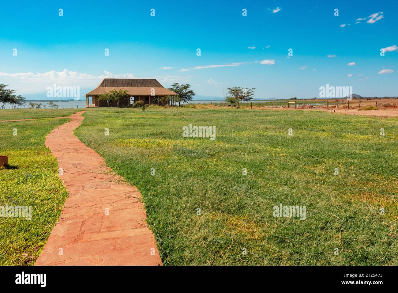 Scenic view of lakeshore cabins at Lake Jipe Campsite at Tsavo West ...