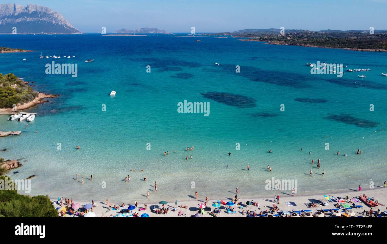 Aerial view of a crowded beach, Costa Smeralda, Olbia, Sardinia, Italy ...