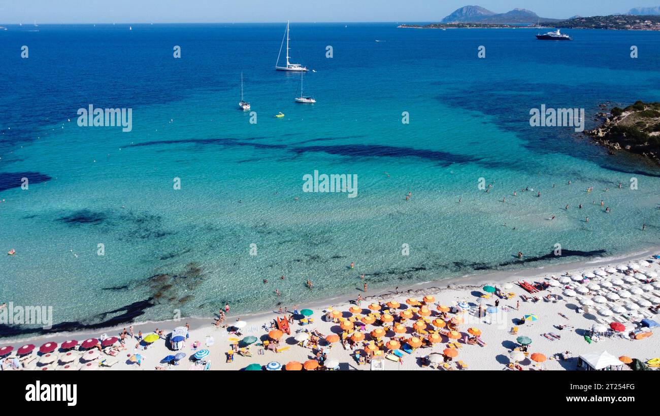 Aerial view of a crowded beach, Costa Smeralda, Olbia, Sardinia, Italy ...