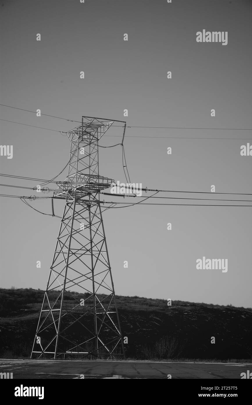 High voltage electrical transmission tower and lines Black and White ...