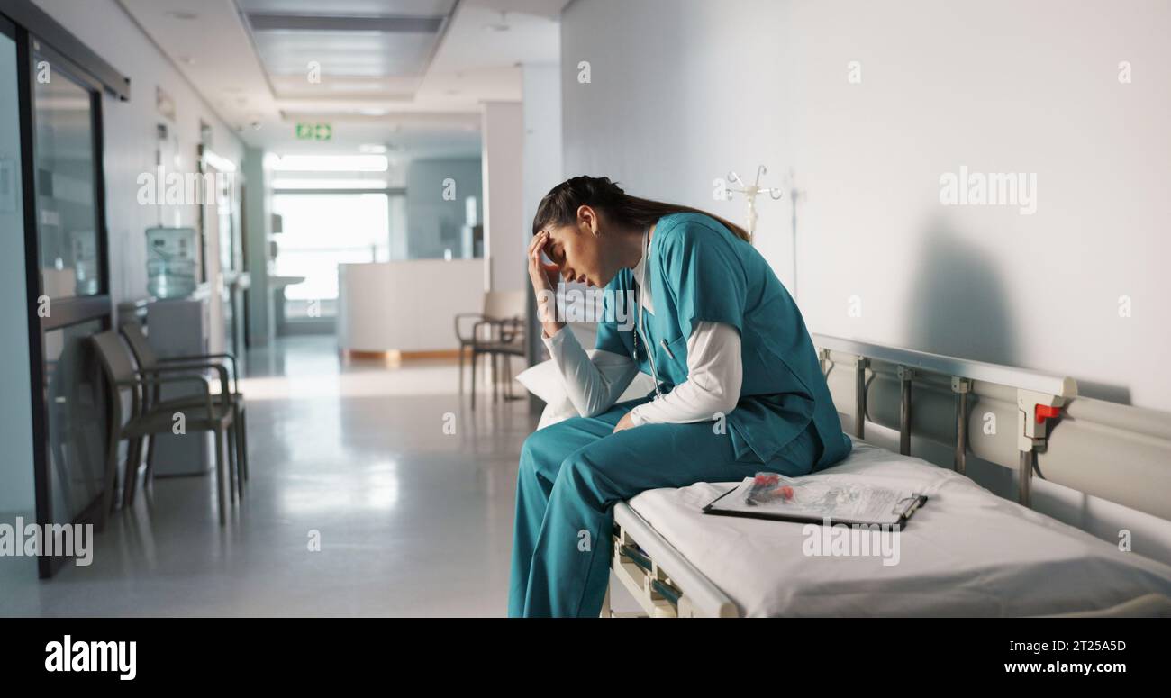 Stress, sad and loss with a woman nurse in hospital after a fail ...