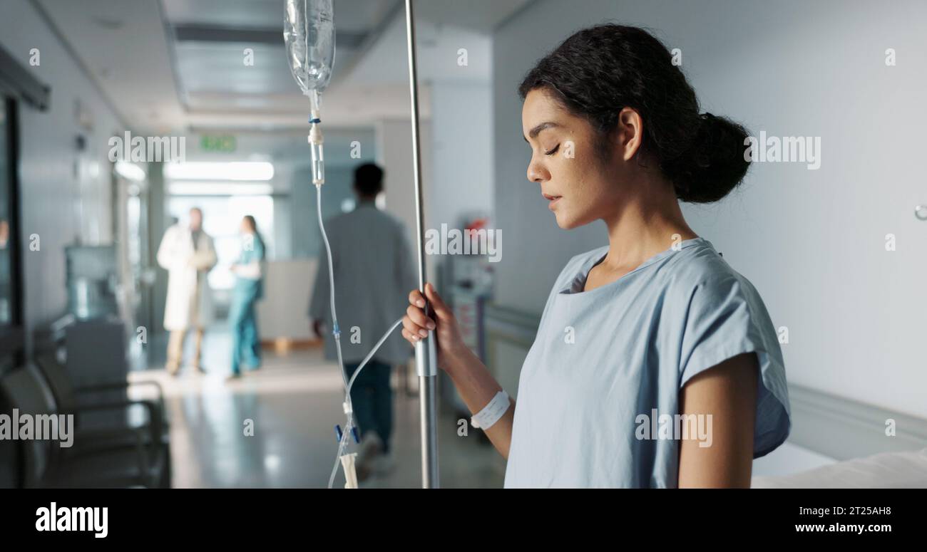 Sad, healthcare and a woman with an iv drip at hospital for medicine ...