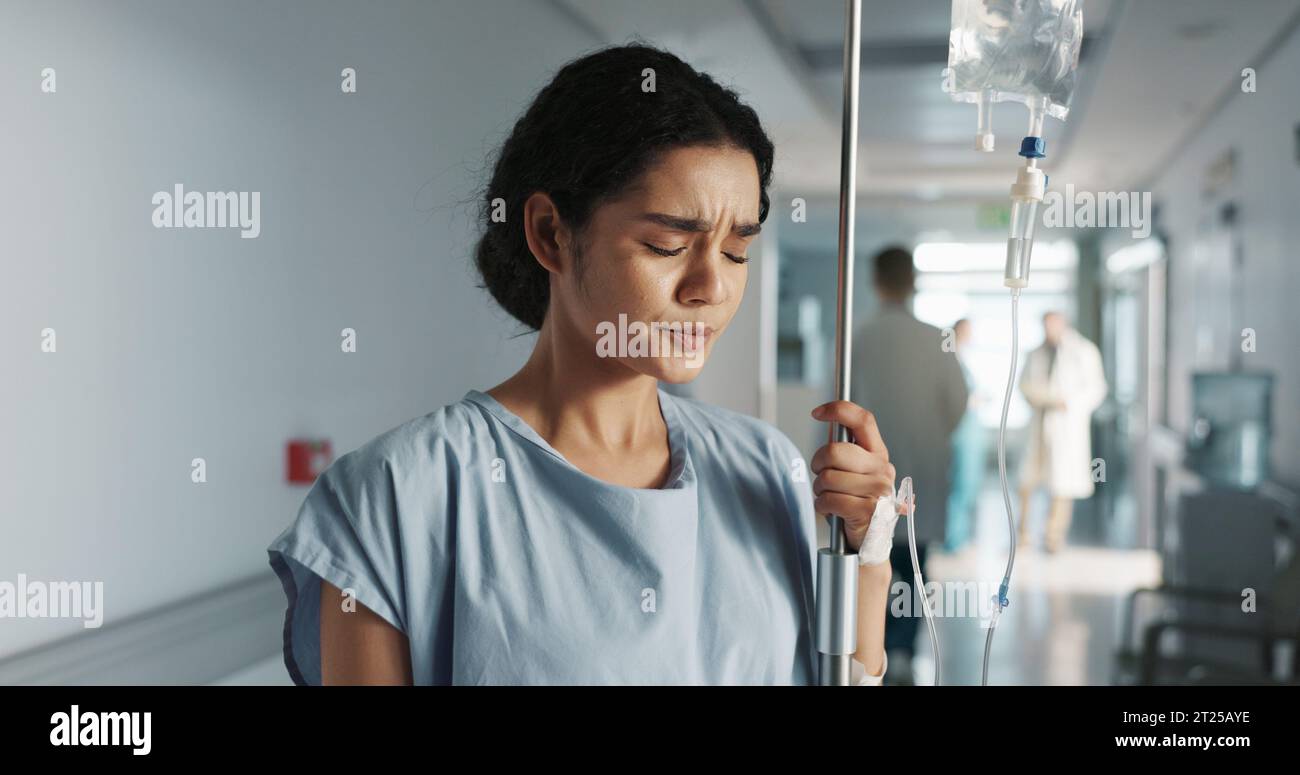 Sad, breathing and a woman with an iv drip at hospital for medicine ...