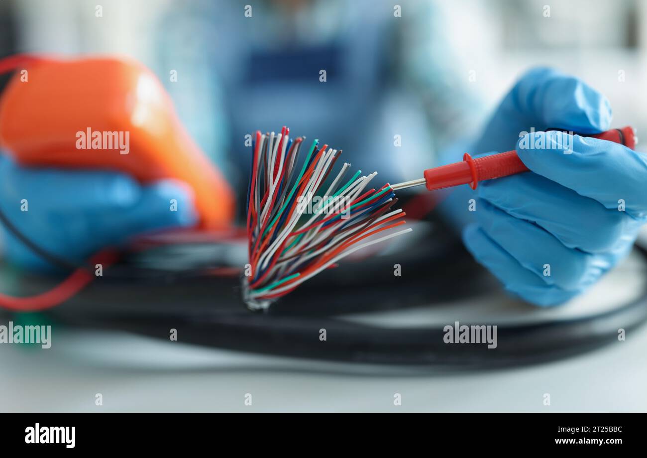 Man measuring voltage with special equipment, tool for checking ...