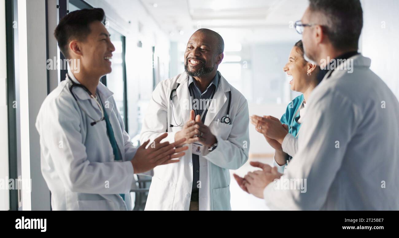 Doctors, nurses and hands together, applause and support, success or collaboration for hospital ...