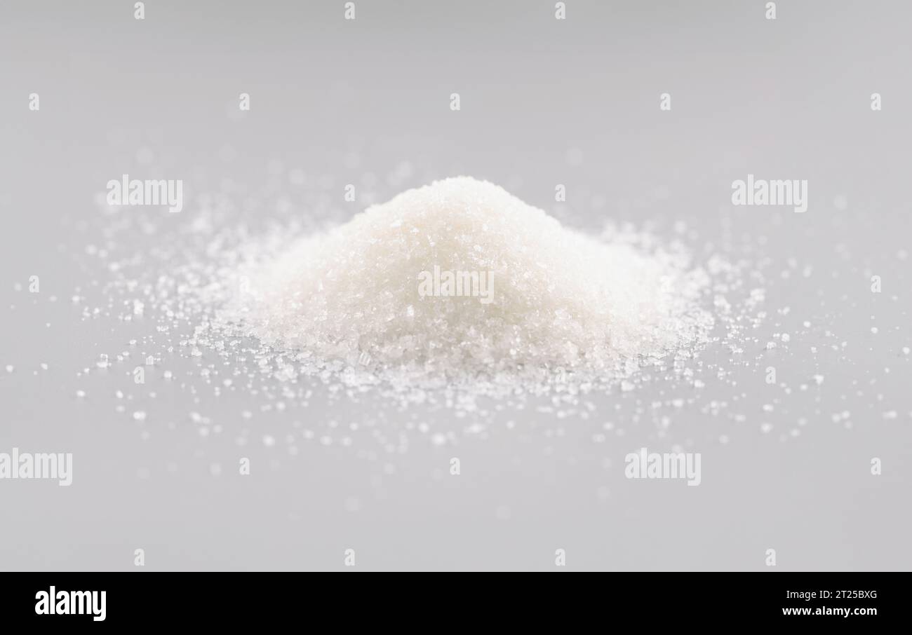 Sugar crystals pile on grey background, heap of sweet powder, sugar ...