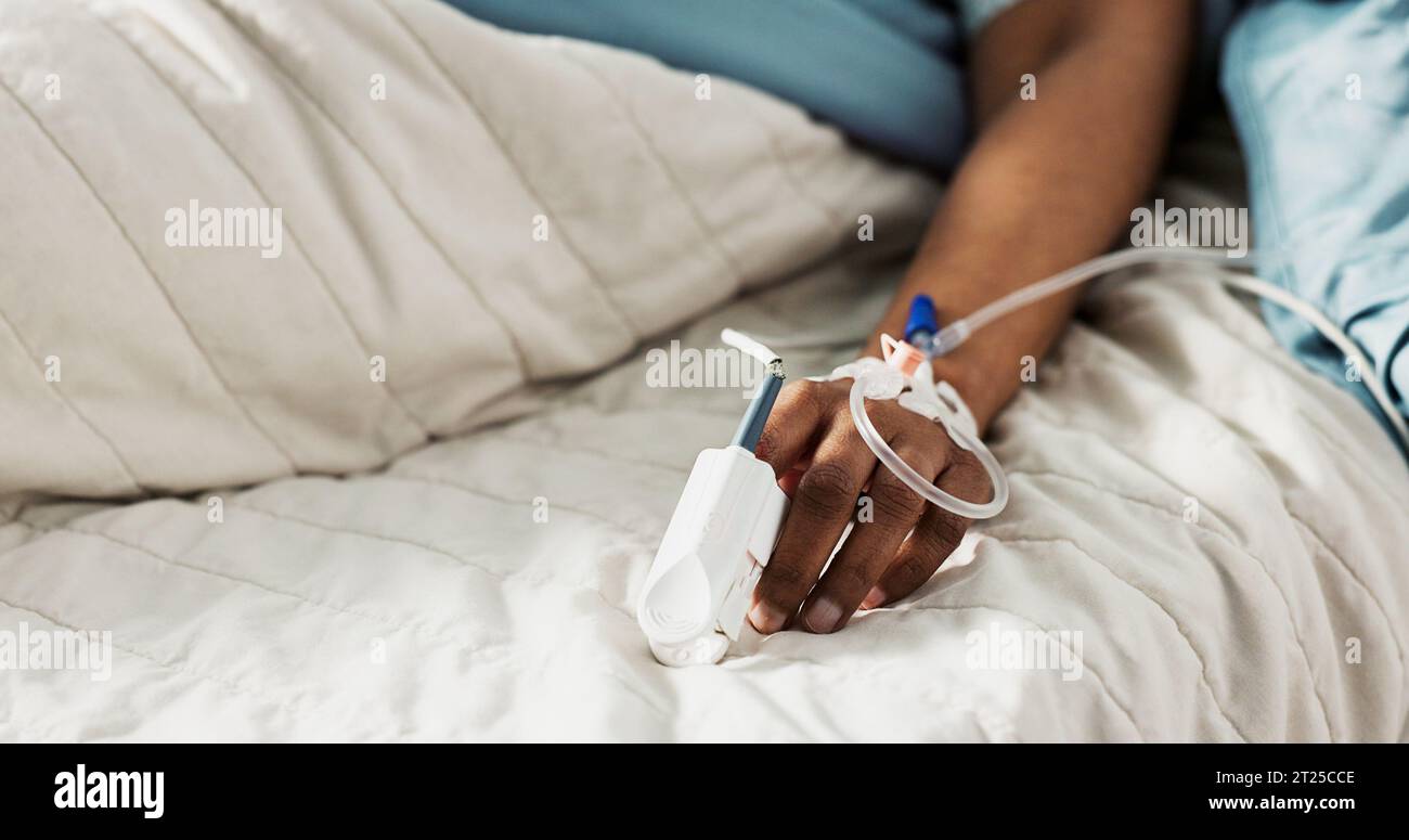 Iv drip, emergency and hand of patient in a hospital after surgery, treatment and operation in a ...