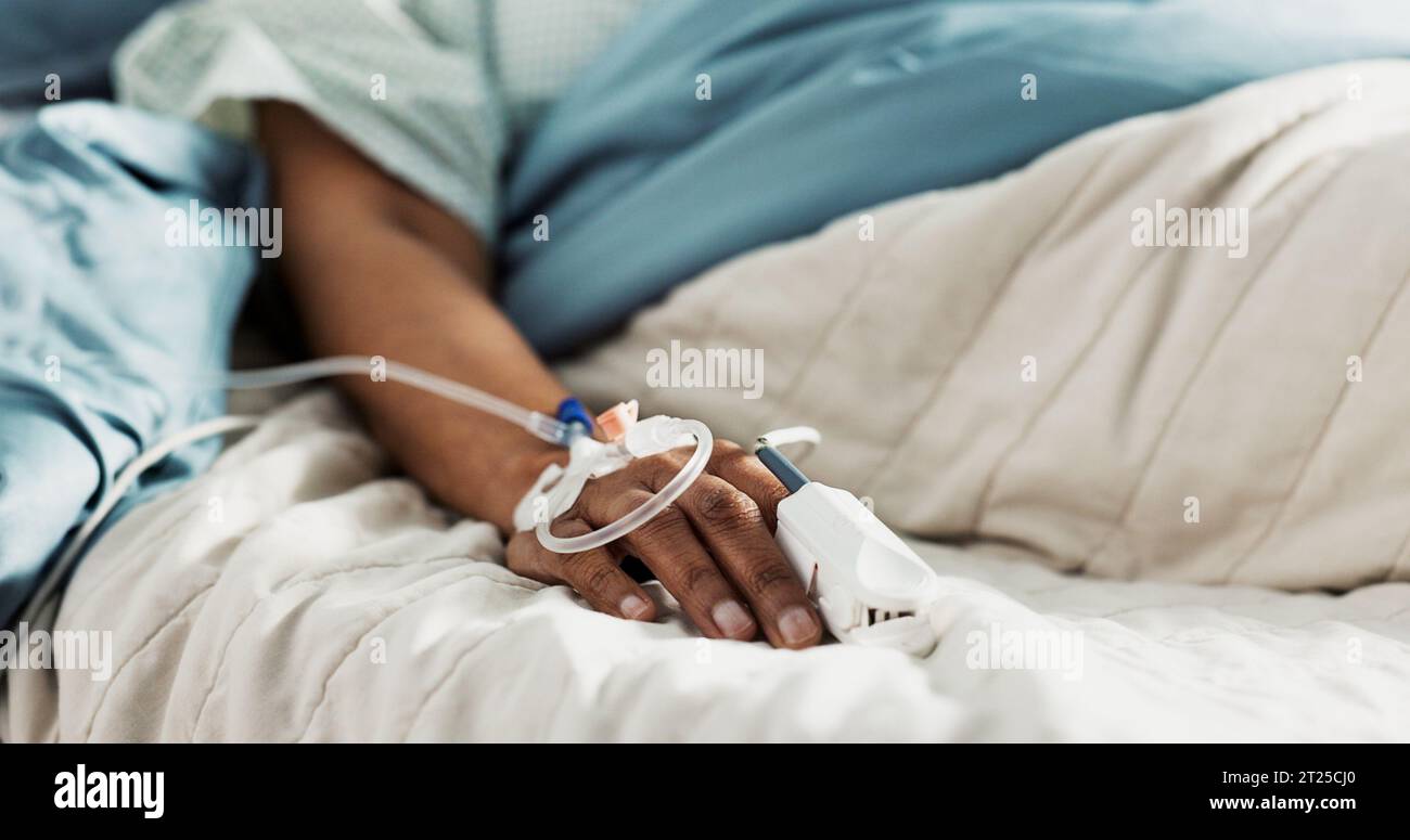 Iv drip, emergency and hand of patient in a hospital after surgery ...