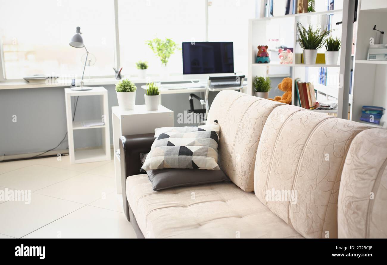 Cozy home interior, sofa with working place and laptop, fresh ...