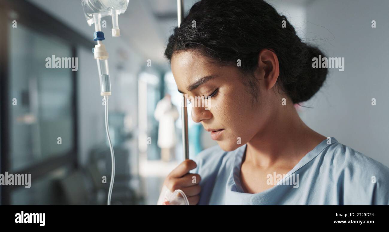 Sad, breathing and a woman with an iv drip at hospital for medicine ...