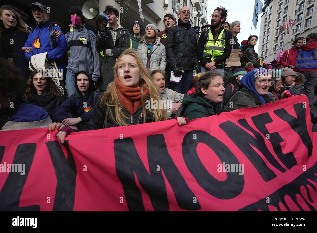 Environmental activist Greta Thunberg and other protesters shout slogan ...