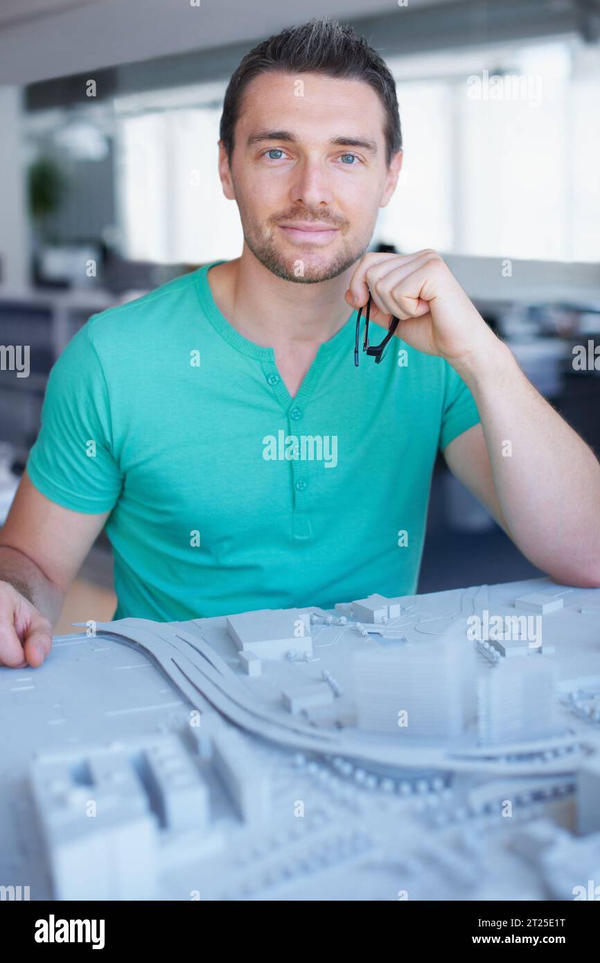 Architecture model, portrait and professional man planning real estate ...