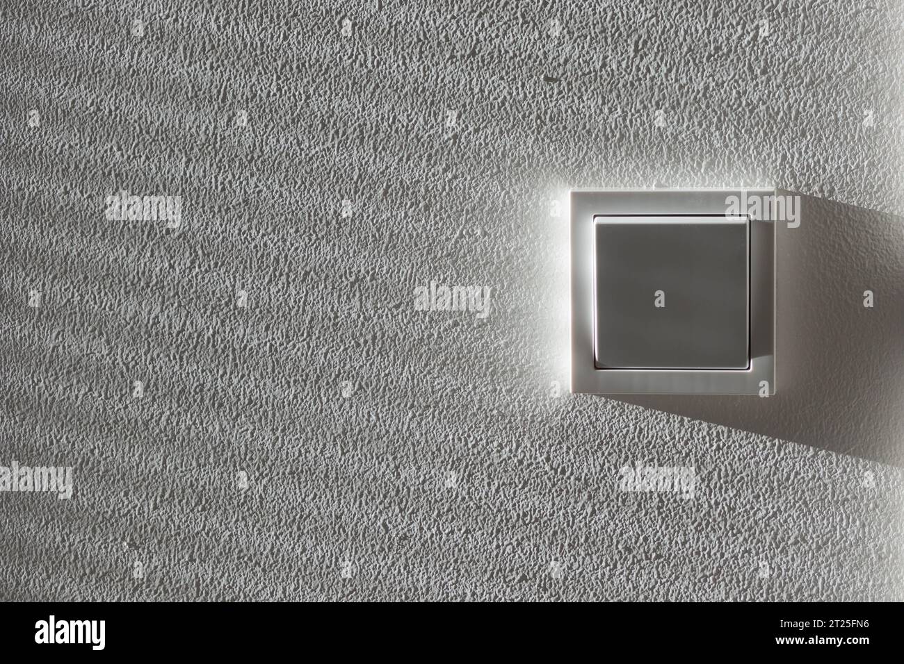 Light switcher on the white wall beneath rays of light banner Stock ...