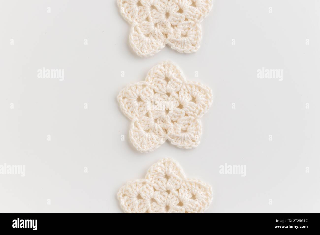 White crocheted stars row pattern on a white background Stock Photo - Alamy