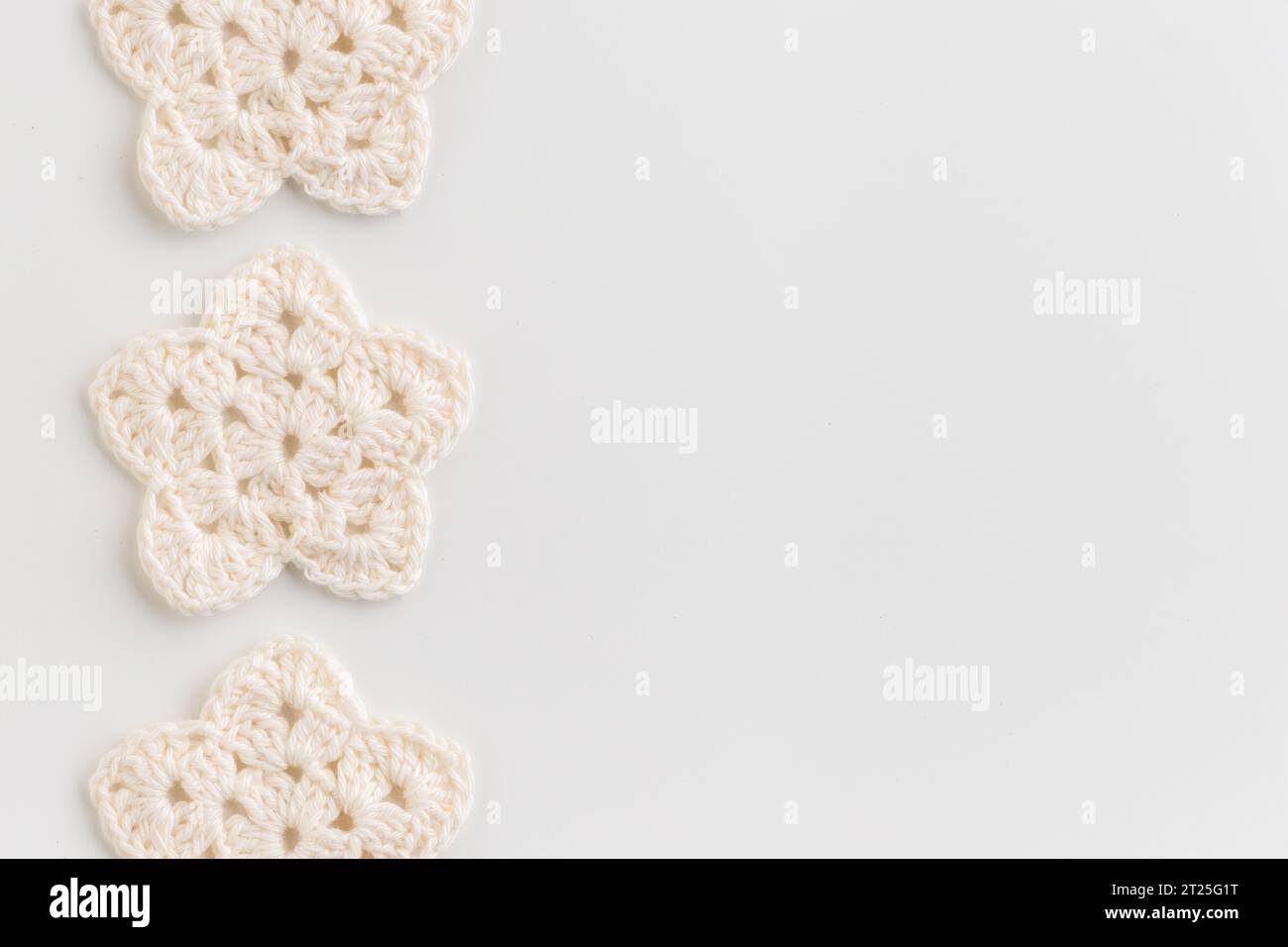 White crocheted stars row pattern on a white background Stock Photo - Alamy