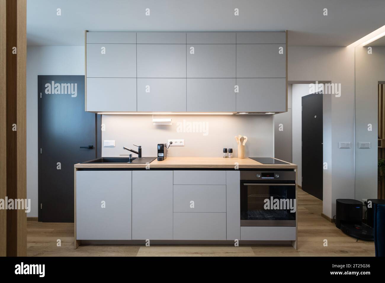 Interior of kitchen in small urban apartment Stock Photo - Alamy