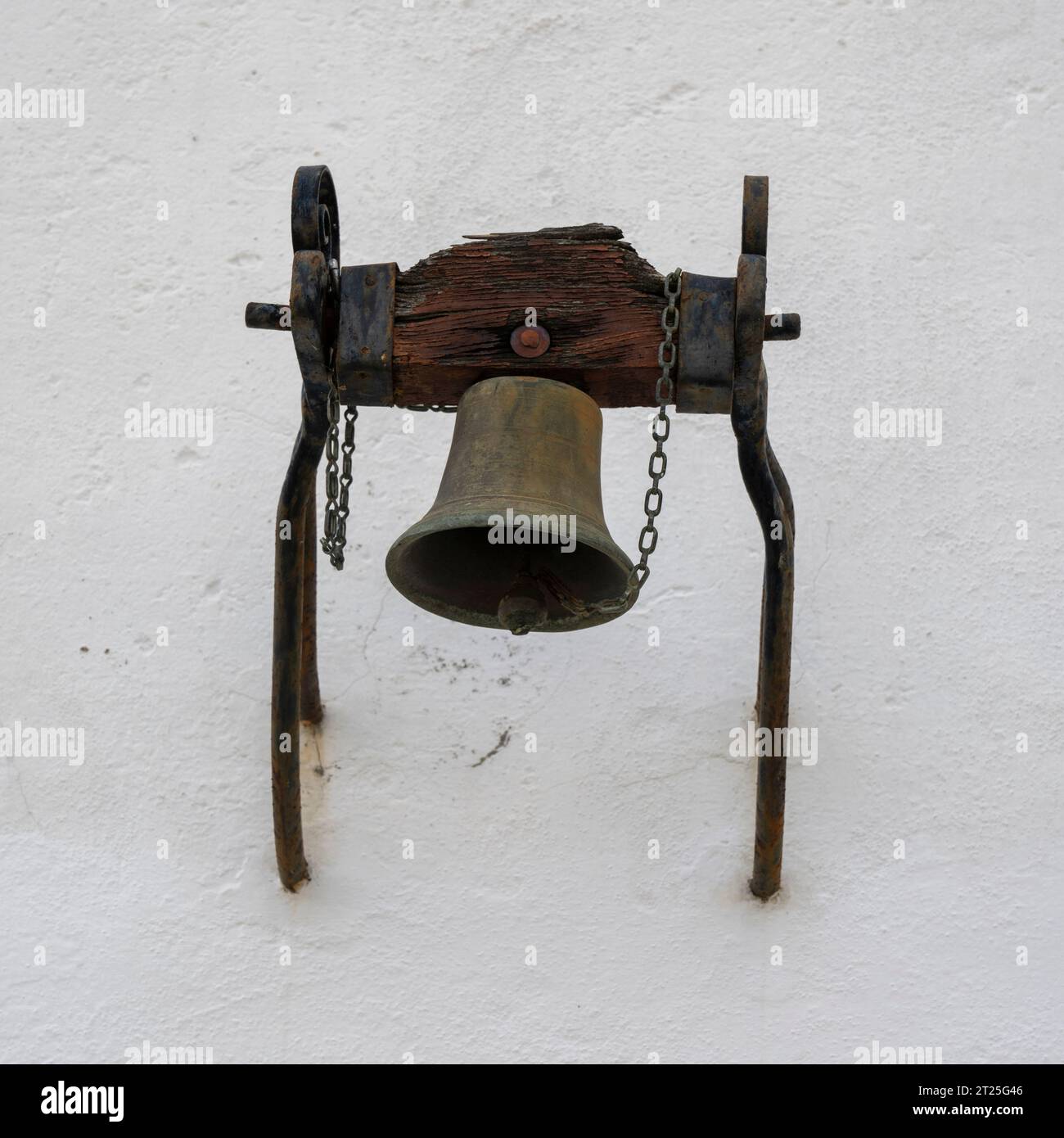 small bell mounted on a wall Old Town, Evora, Alentejo, Portugal Stock ...