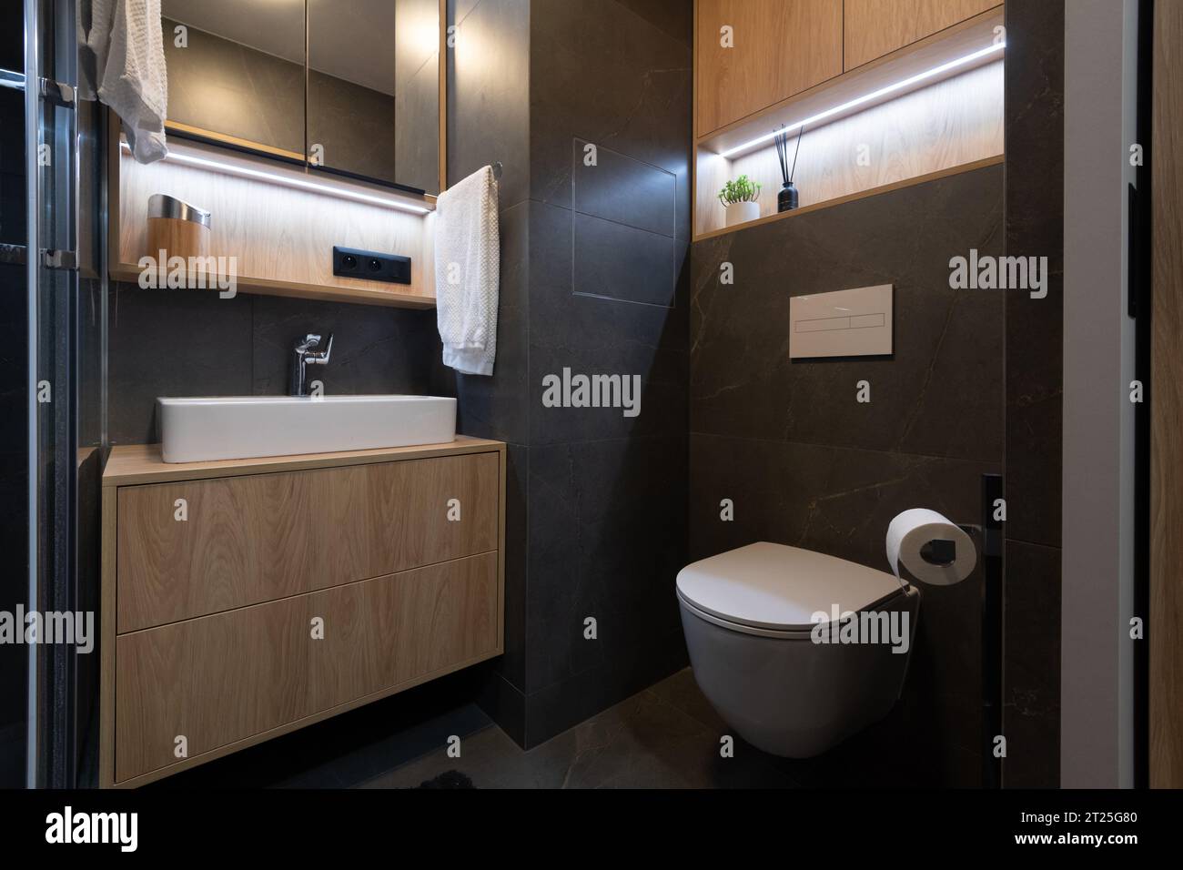 Restroom of small urban apartment Stock Photo - Alamy