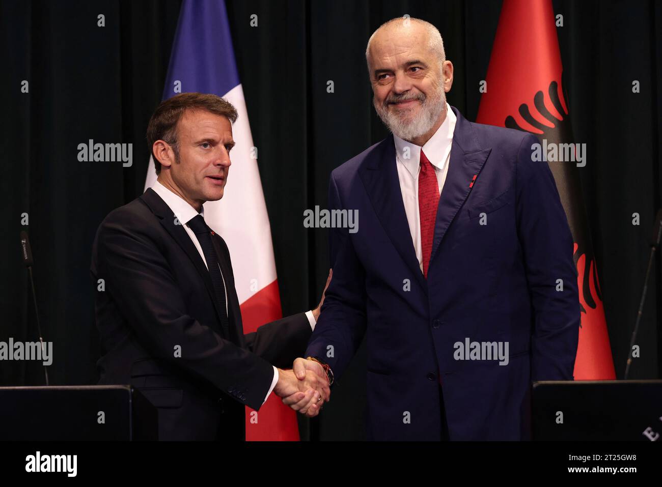 French President Emmanuel Macron, left, shakes hands with Albanian ...