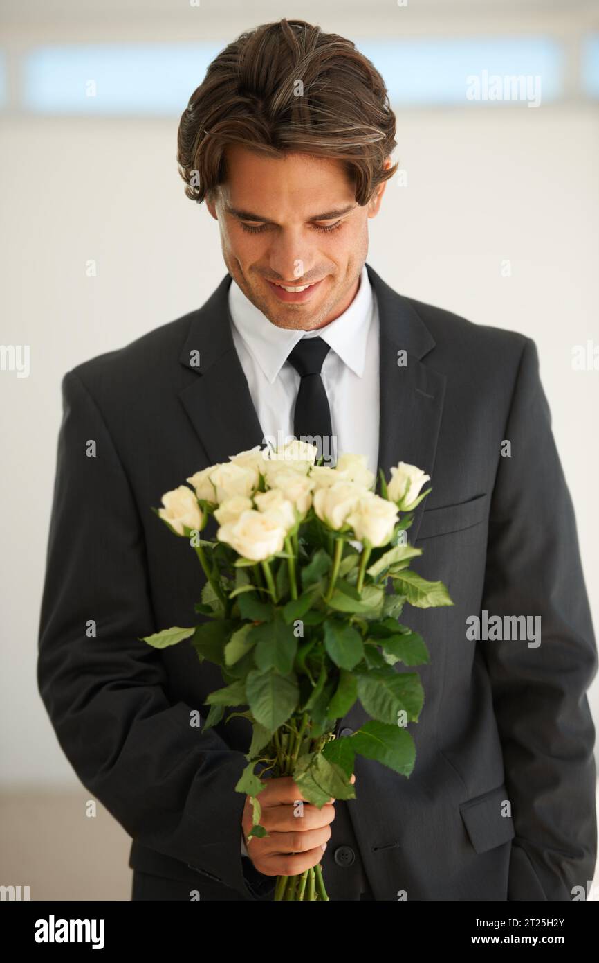 Young man waiting bunch flowers hi-res stock photography and images - Alamy