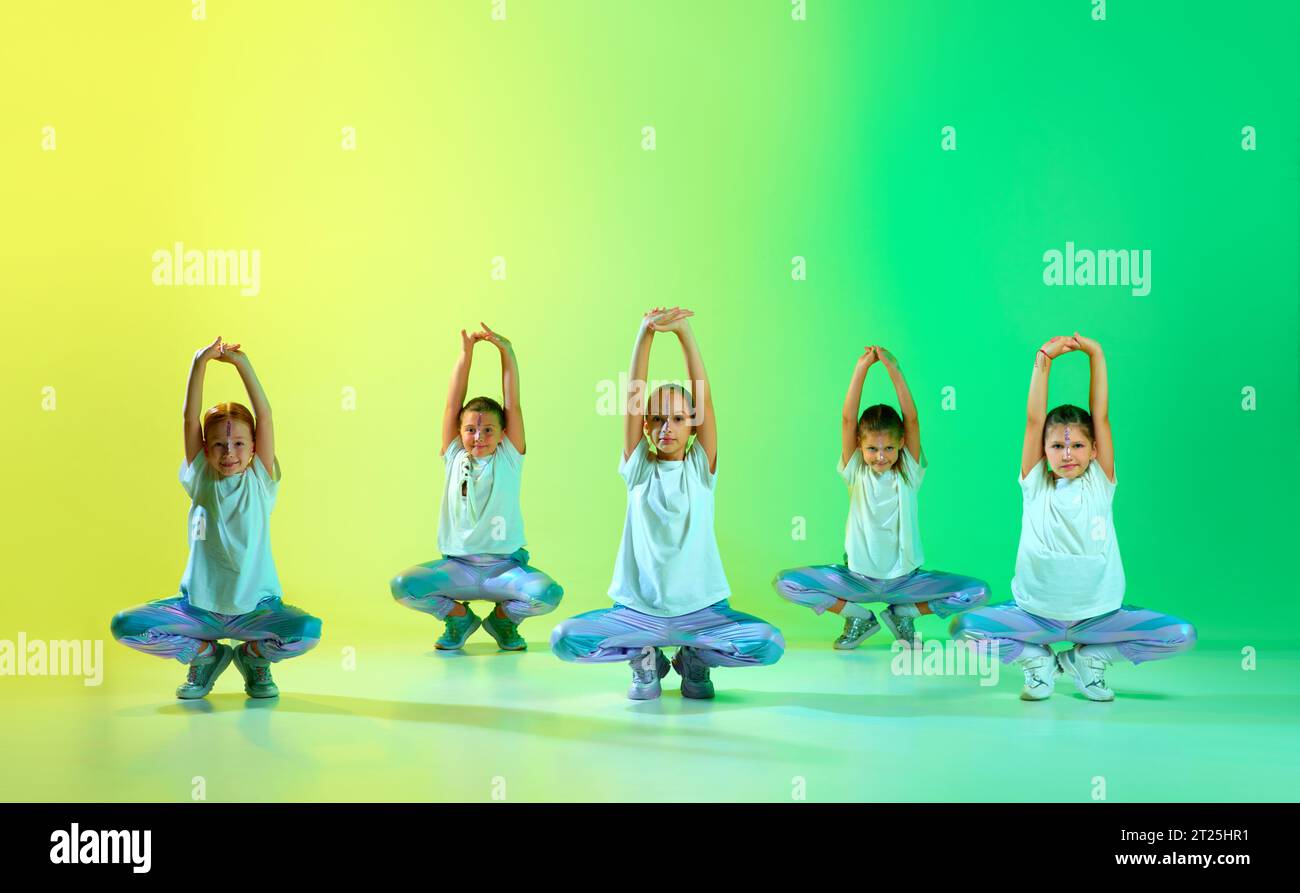 Cute talented children dressed in fashion clothes with bright glittered ...