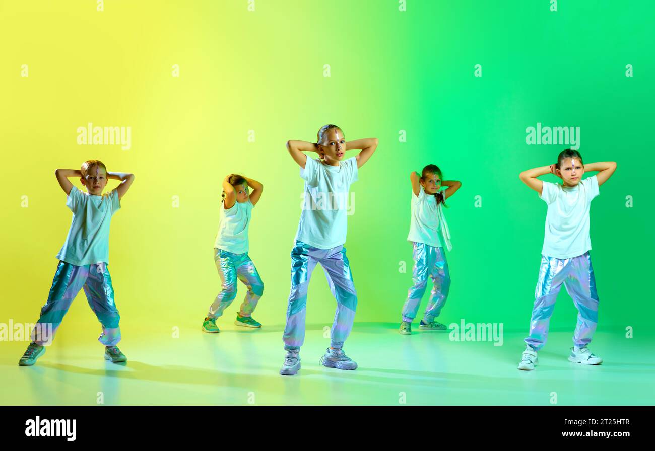 Cute talented children dressed in style clothes with bright glittered ...