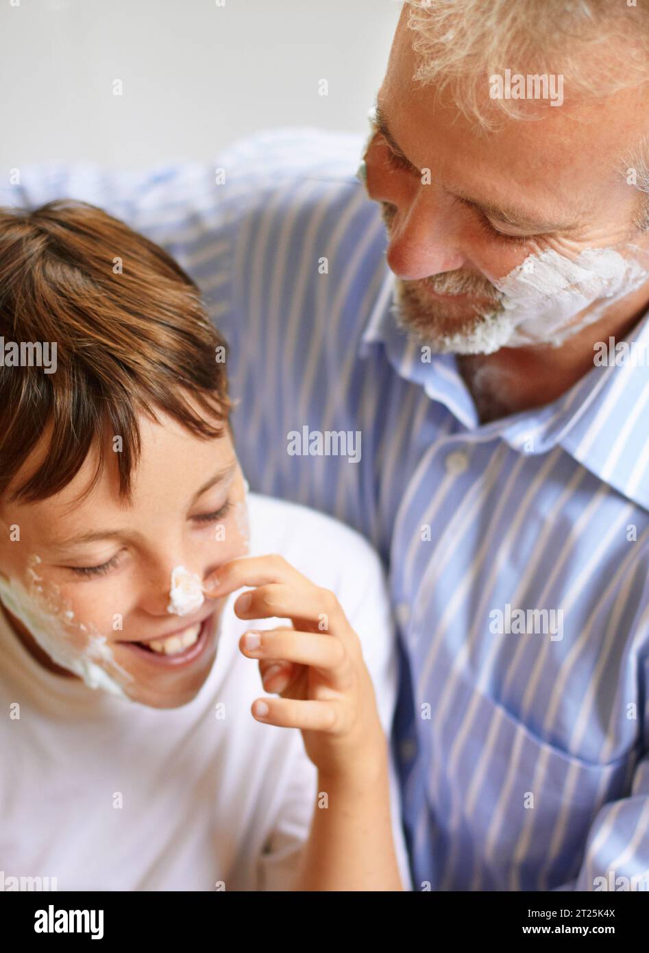 Father, son and face with shaving cream and smile for grooming for ...