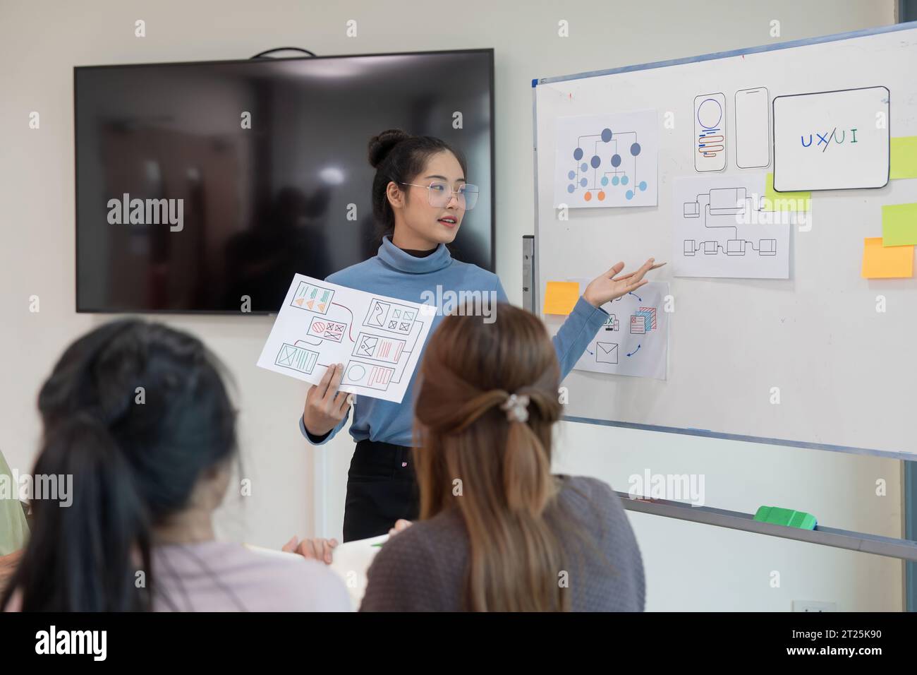 ux developer and ui designer presenting and testing mobile app ...