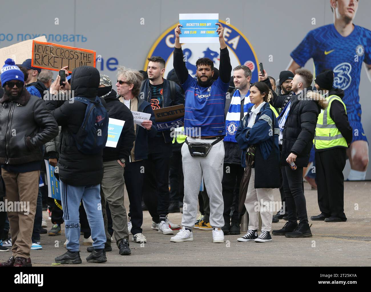 Chelsea fans protest outside Stamford Bridge stadium with signs saying ...