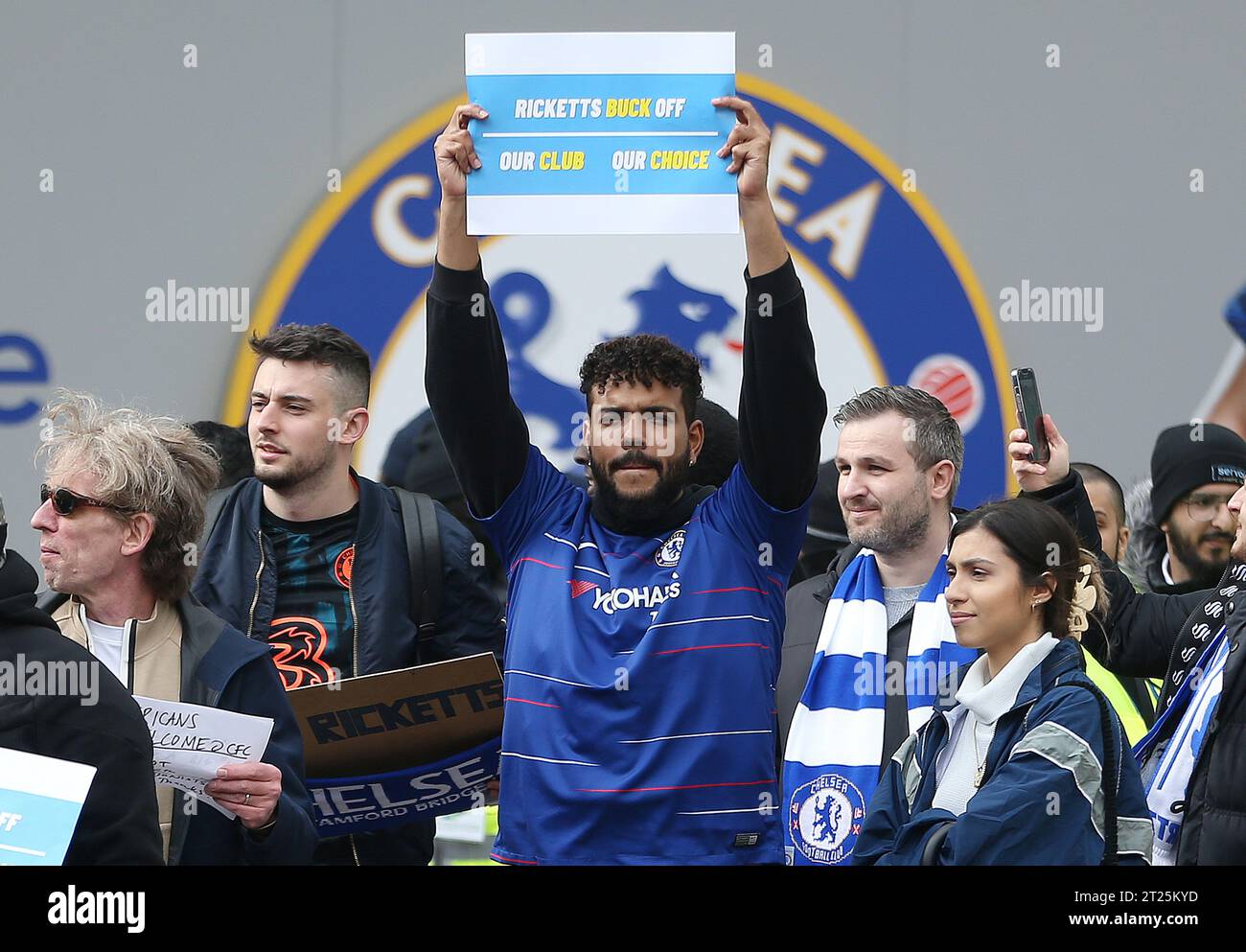 Chelsea fans protest outside Stamford Bridge stadium with signs saying ...