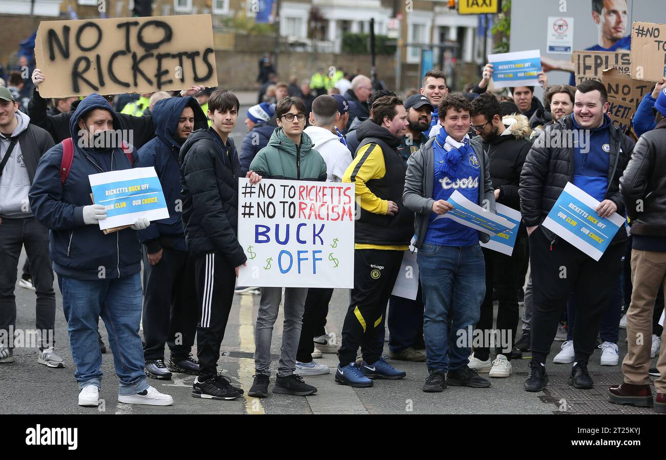Chelsea fans protest outside Stamford Bridge stadium with signs saying ...
