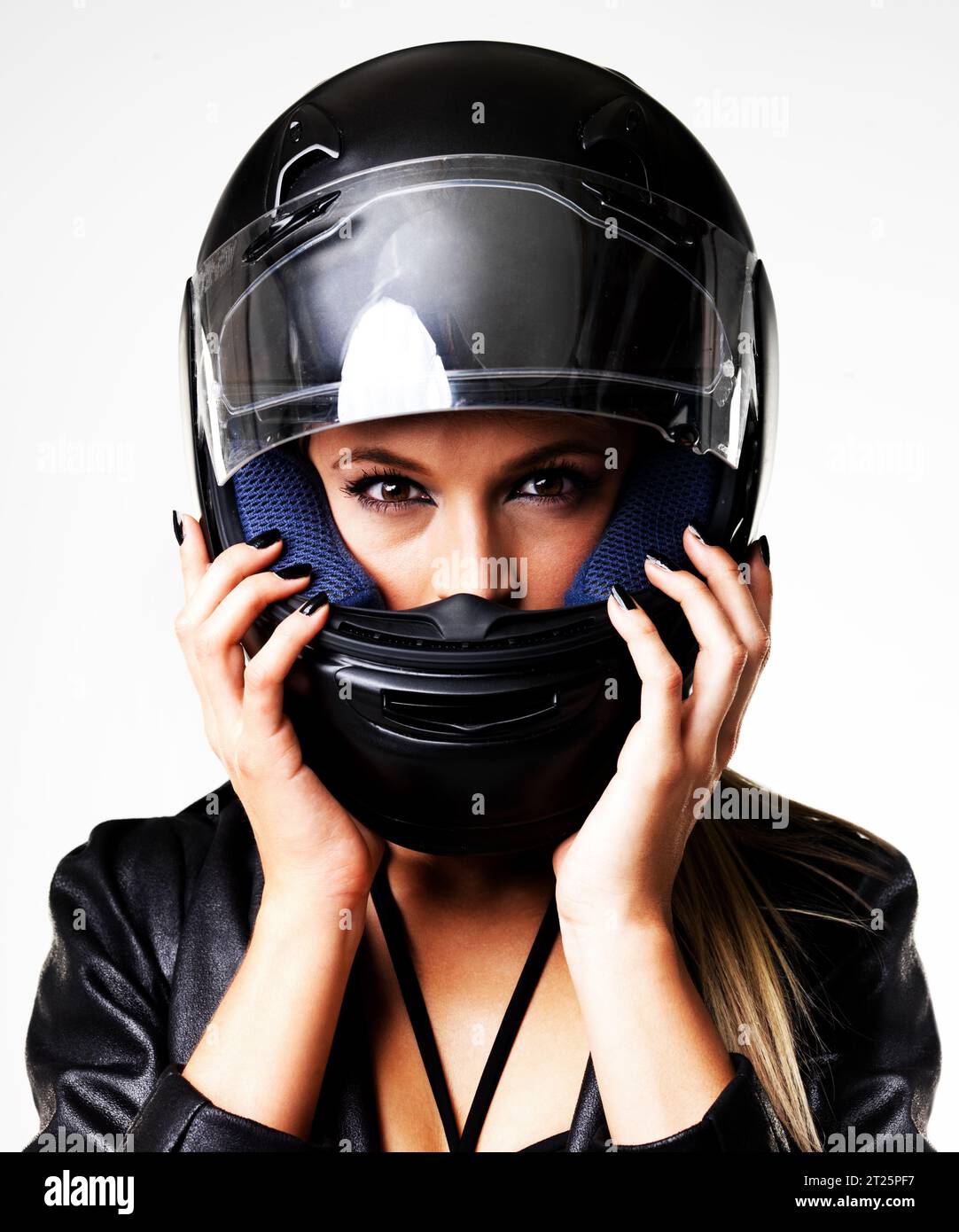 Closeup, face and woman with motorbike helmet on a studio background ...