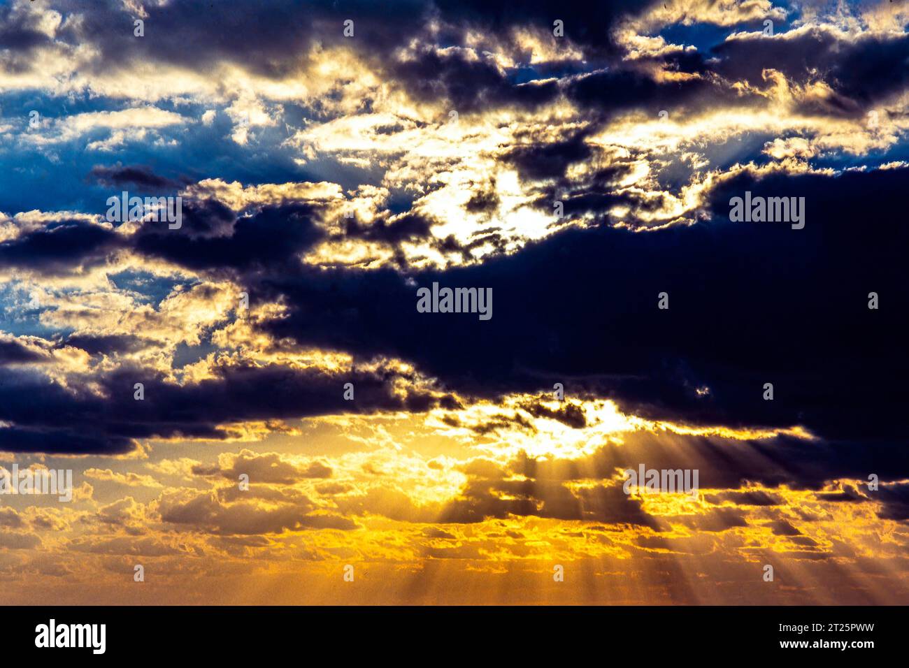 Sun rays through storm clouds hi-res stock photography and images - Alamy