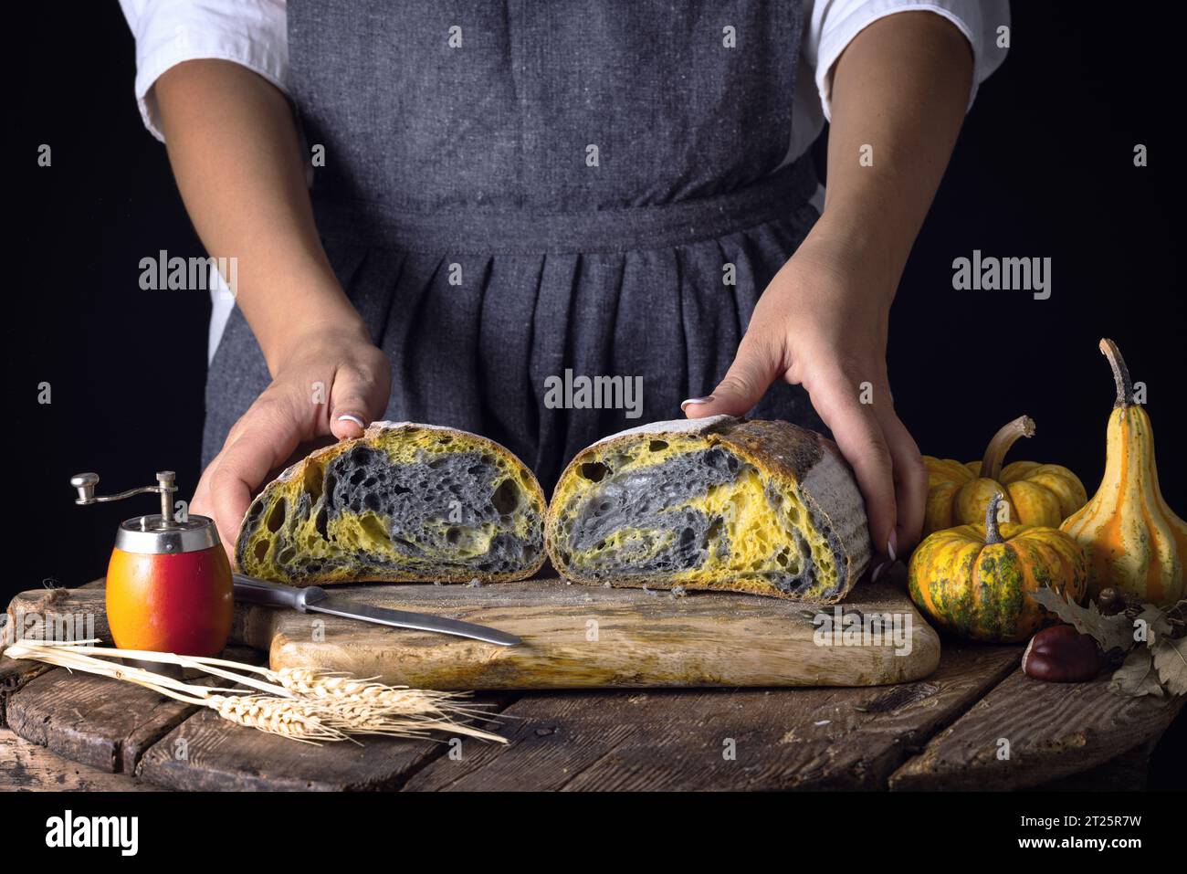 Homemade crusty sourdough bread oven baked and woman baker with autumn ...