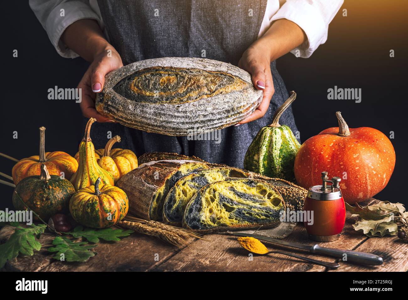 Homemade crusty sourdough bread oven baked and woman baker with autumn ...