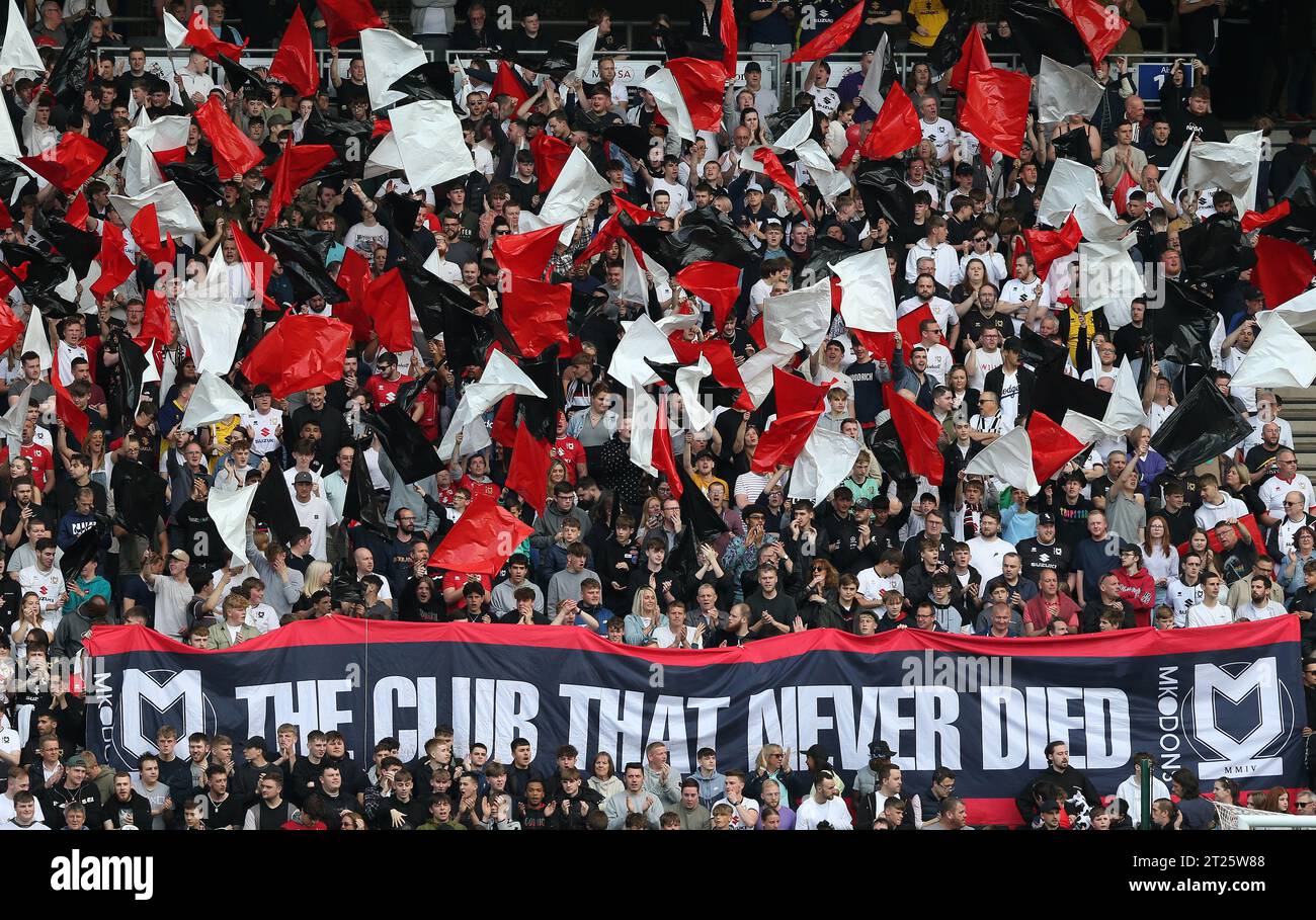 Milton Keynes Dons fans hold aloft a banner which reads 'The Club That ...
